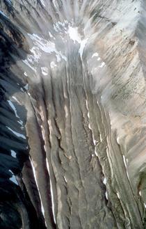 Rock glaciers: their ice and debris balances